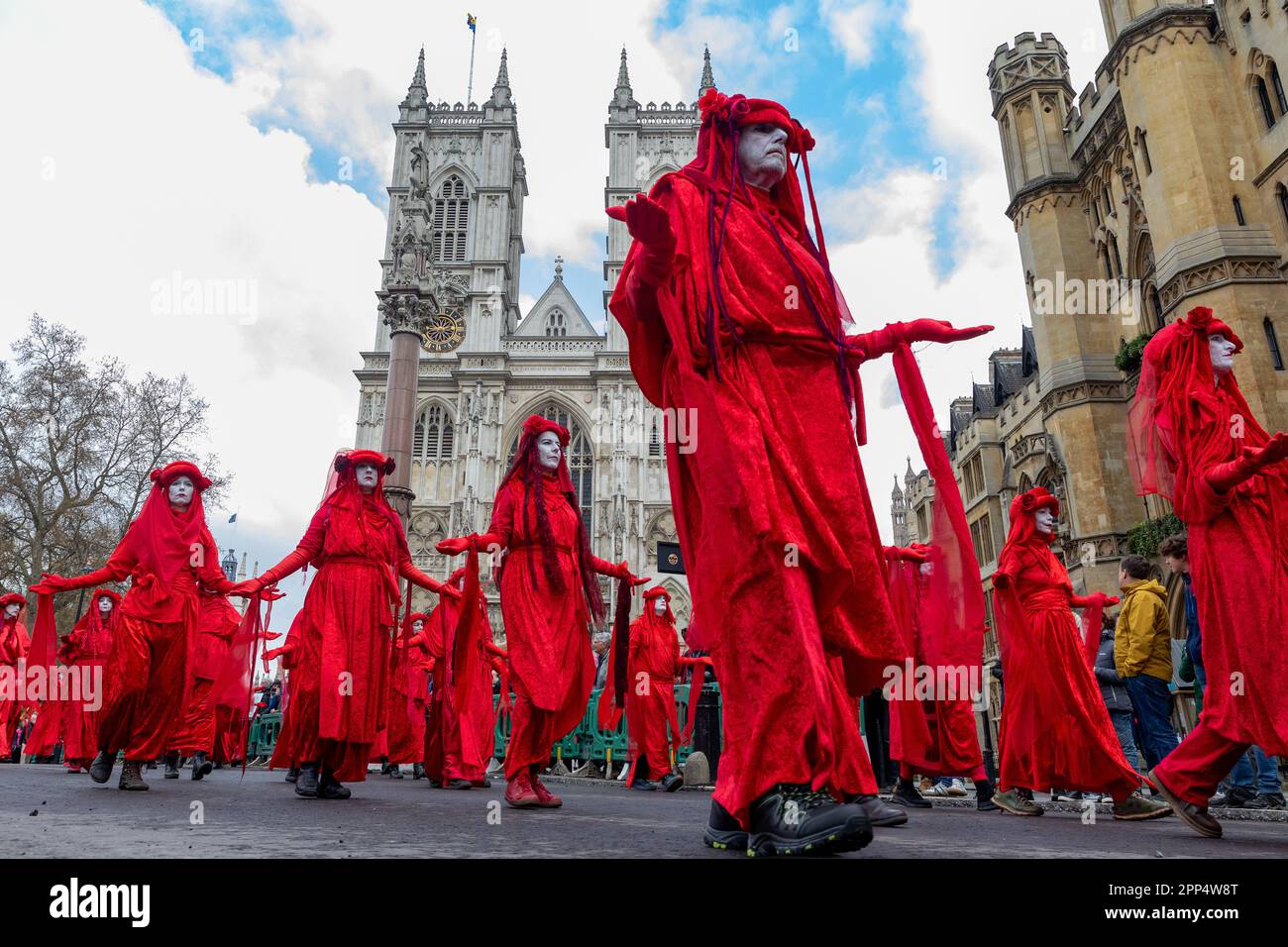 London, UK. 21st April, 2023. Extinction Rebellion Red Rebels pass ...