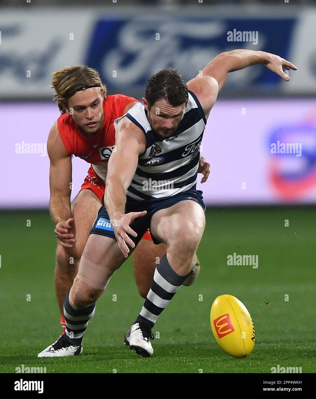 James Rowbottom of the Sydney Swans (left) and Patrick Dangerfield of ...