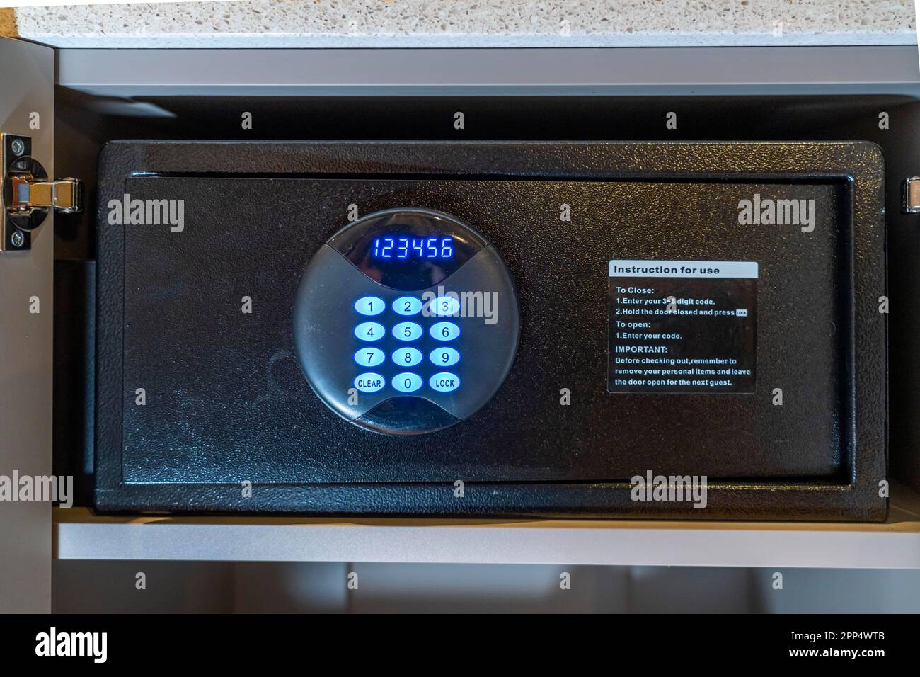 Room safe in a hotel, keypad for entering a 6-digit numerical code to ...