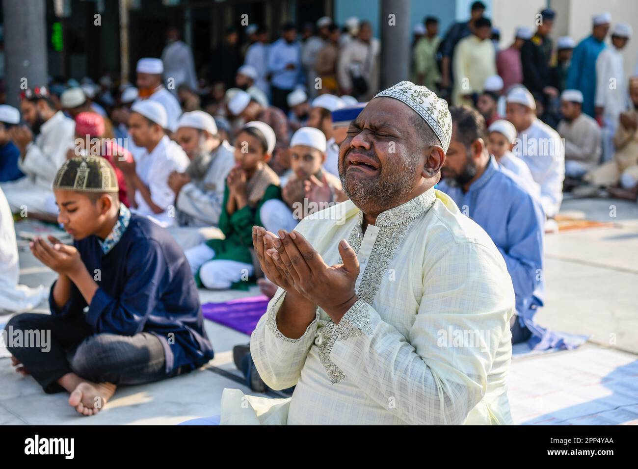 A Muslim man offer prayers on the first day of Eid al-Fitr, which marks ...