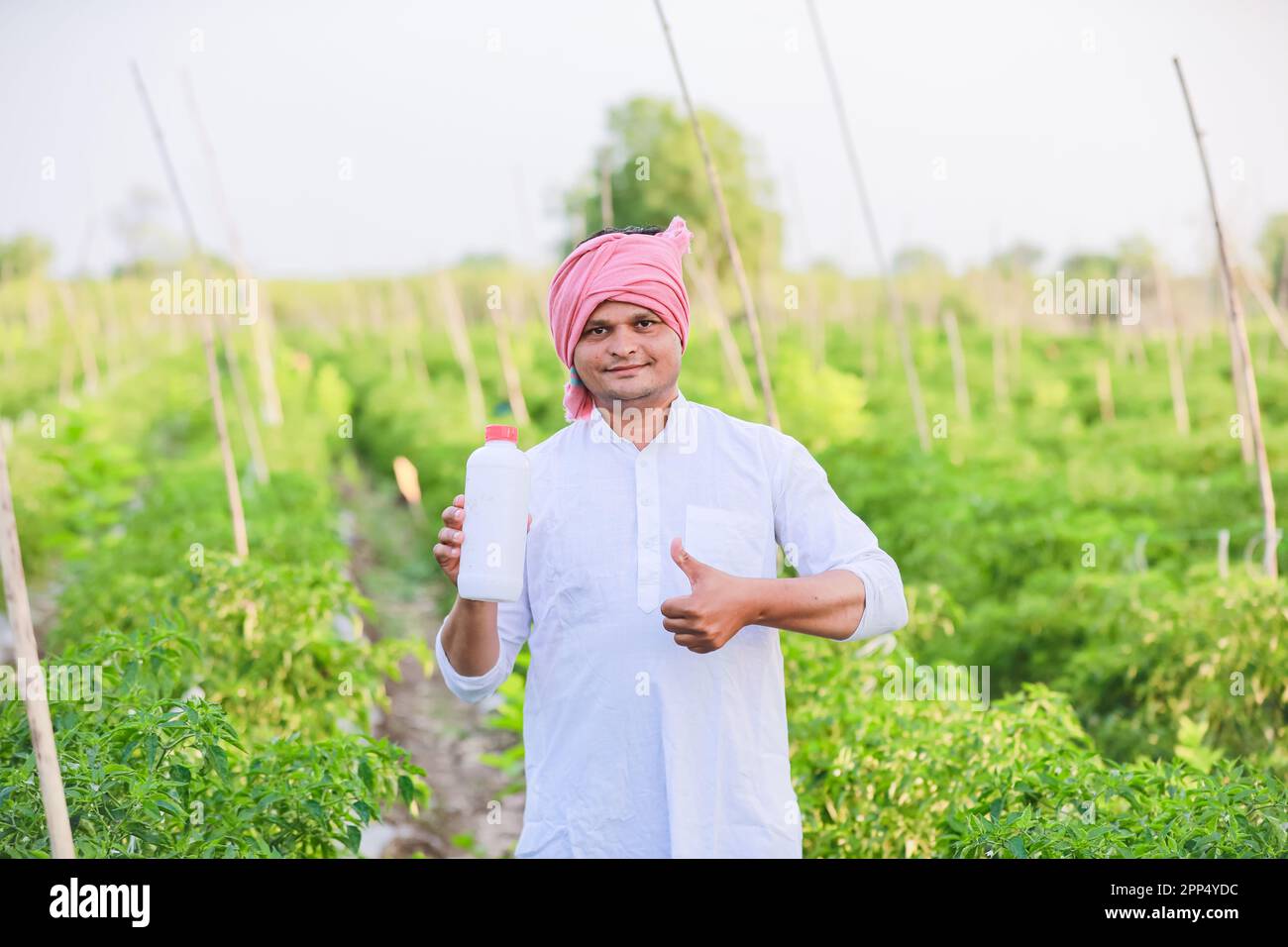 Young indian farmer showing Smart phone , Farmer talking on phone in ...