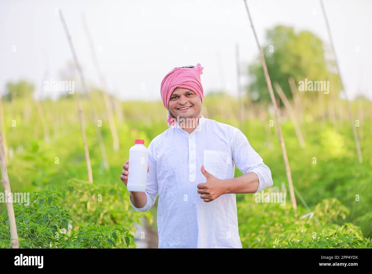 Young indian farmer showing Smart phone , Farmer talking on phone in ...
