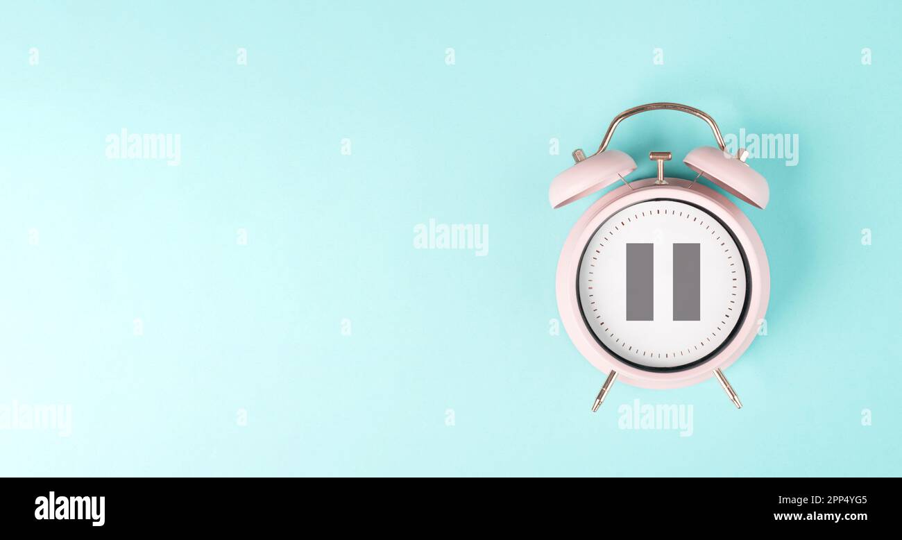 Alarm clock with pause sign, take a break, menopause concept, hormone ...