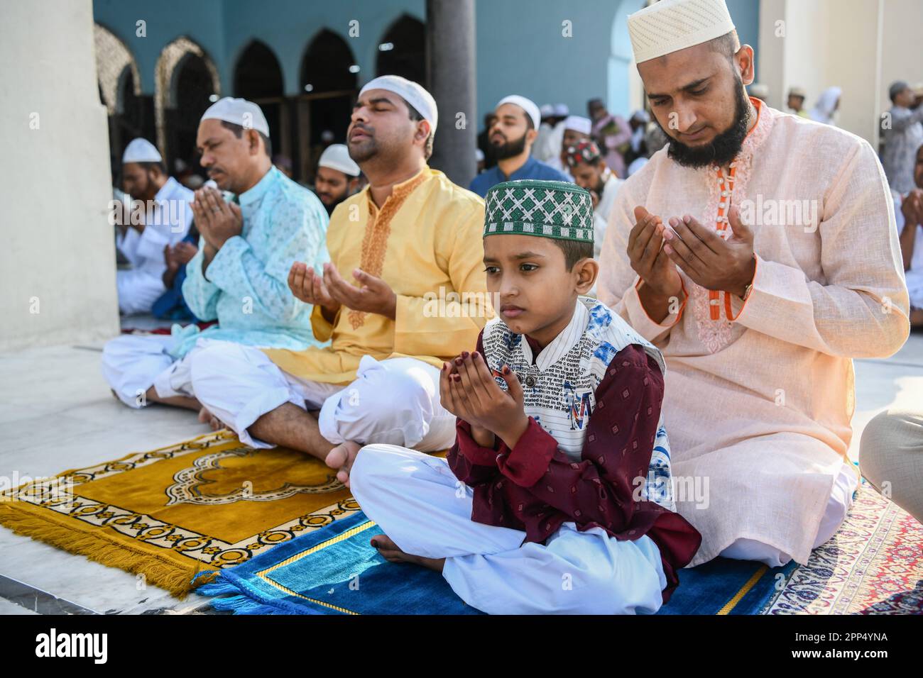 A child offer prayers on the first day of Eid al-Fitr, which marks the ...