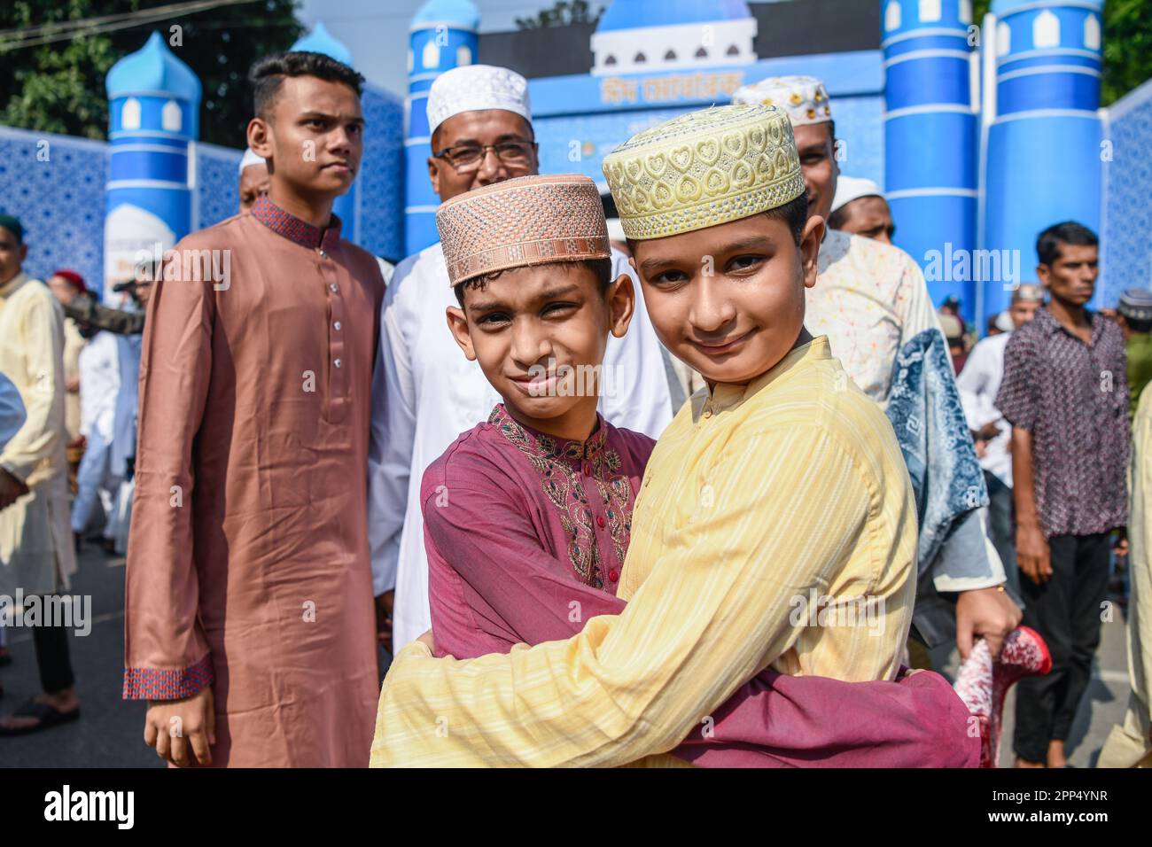 Muslim kids hug after Eid al-Fitr prayers at the National Eidgah Maidan in Dhaka. (Photo by ...