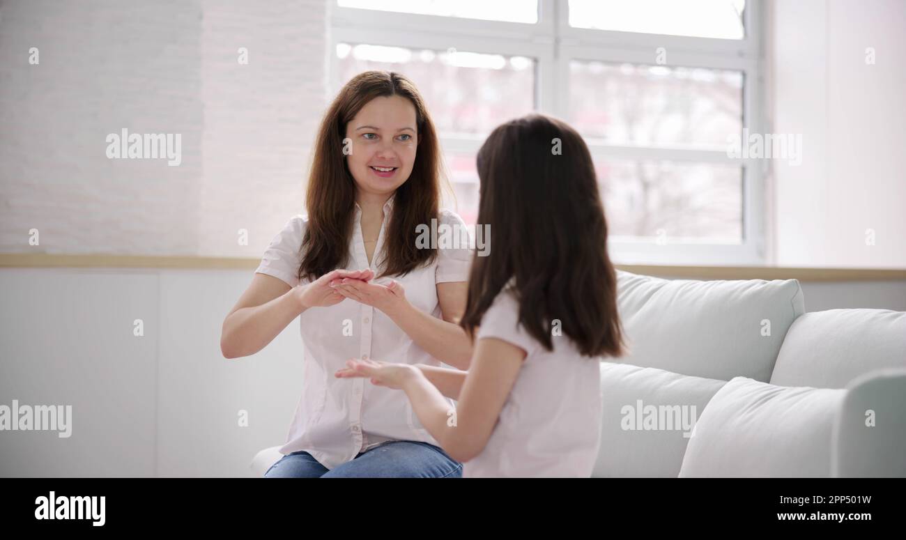 Child Learning Sign Language. Hearing Disabilities And Audiology Stock ...