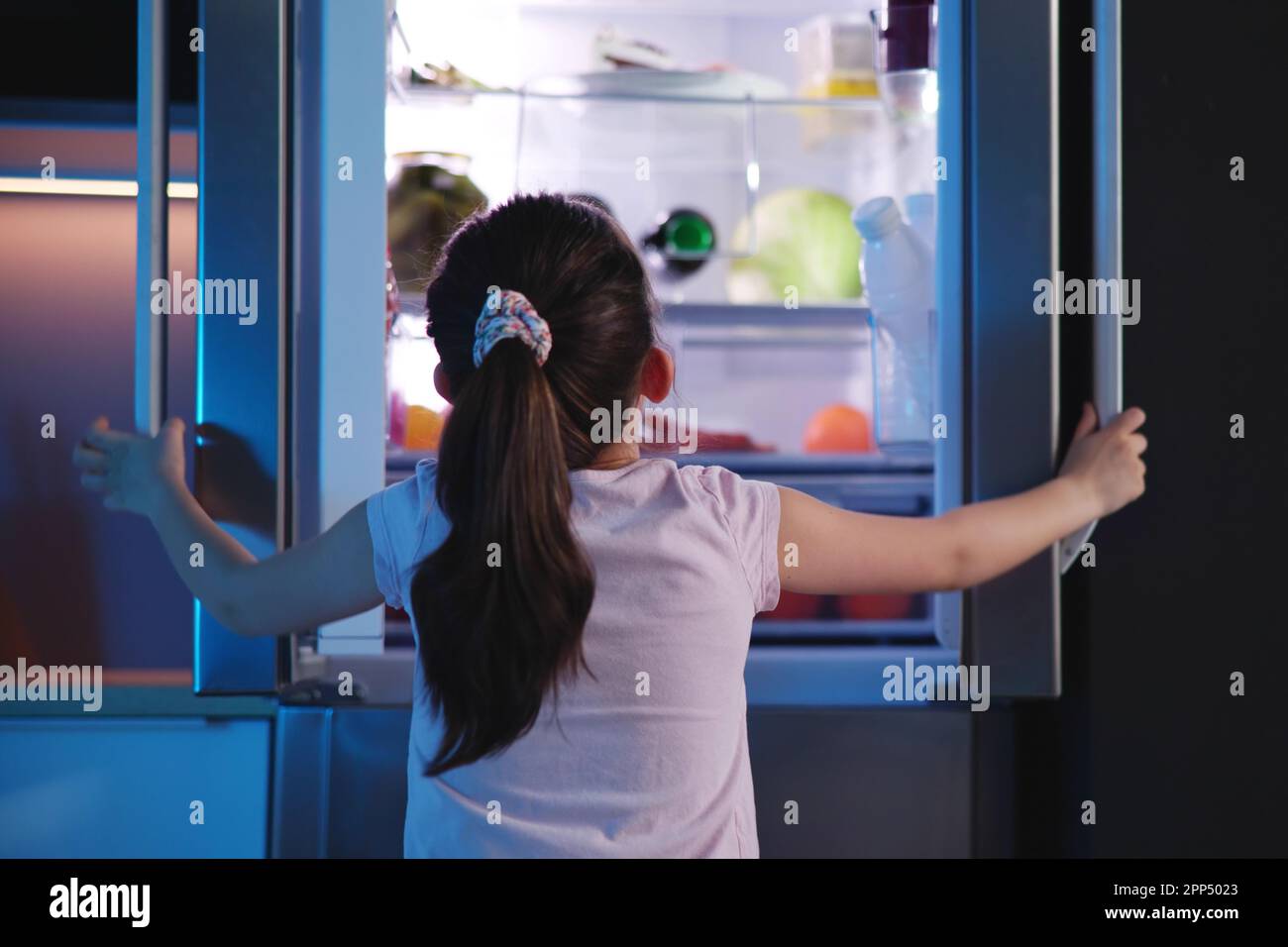 Child Girl Taking Food Fridge At Night Stock Photo - Alamy