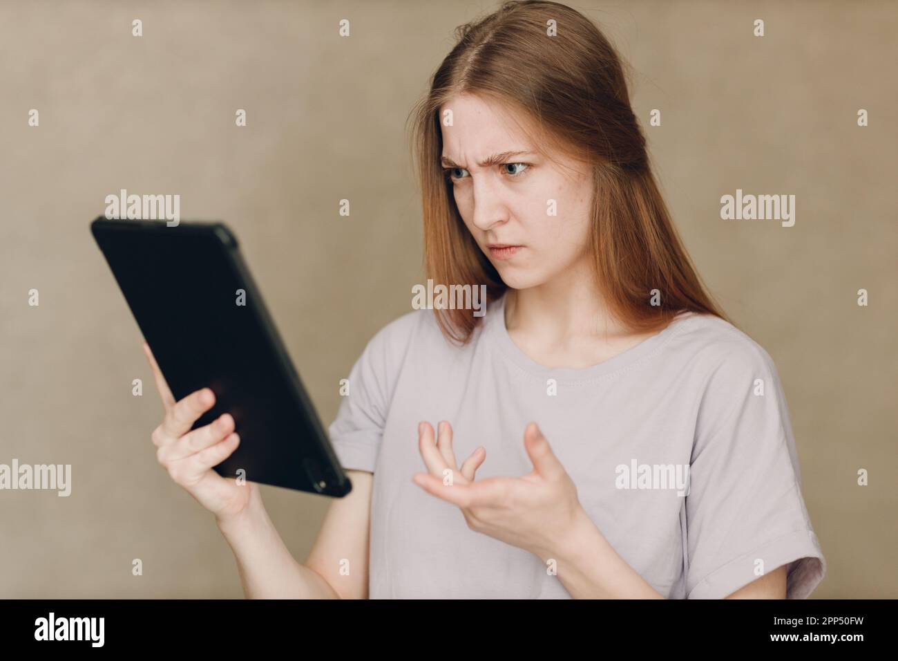 Portrait of young student actress learning role woman with digital ...