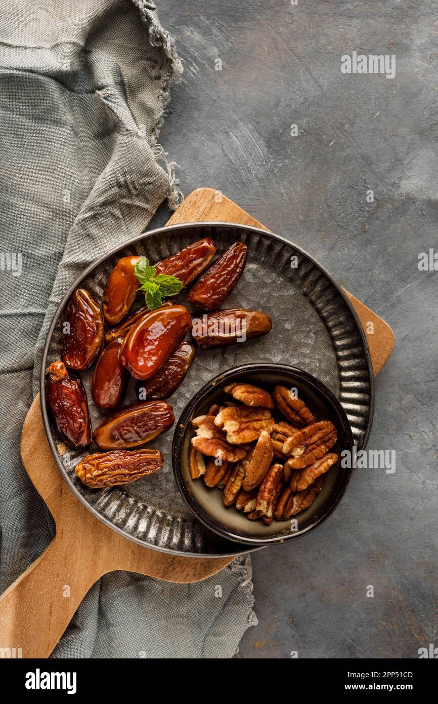Top view dates nuts arrangement Stock Photo - Alamy