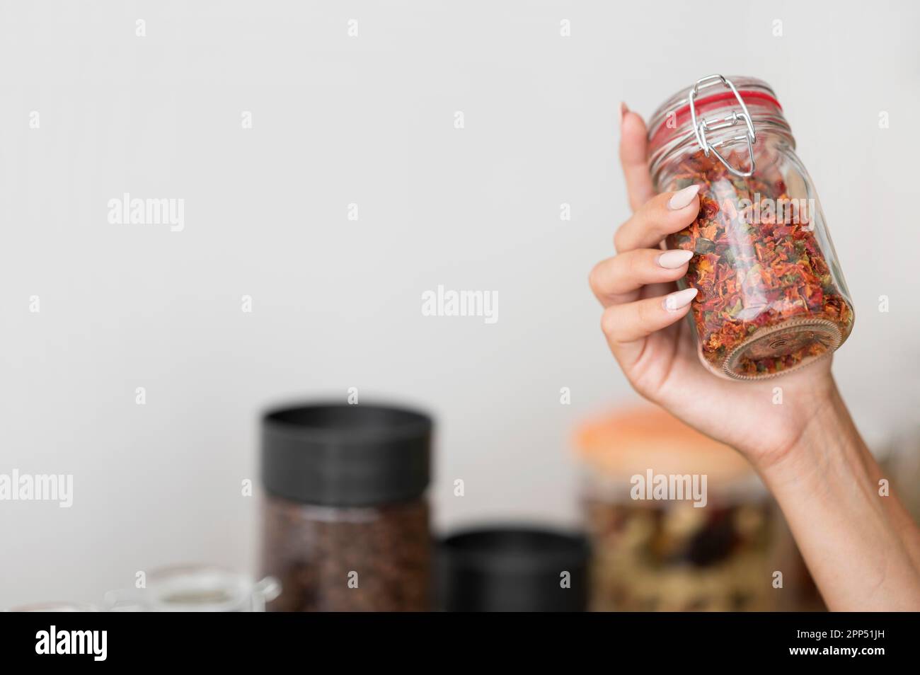 Woman holding jar full hi-res stock photography and images - Alamy