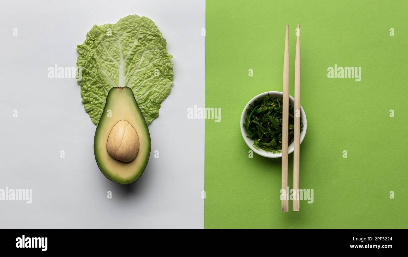 Flat lay avocado with bowl greens chopsticks Stock Photo - Alamy