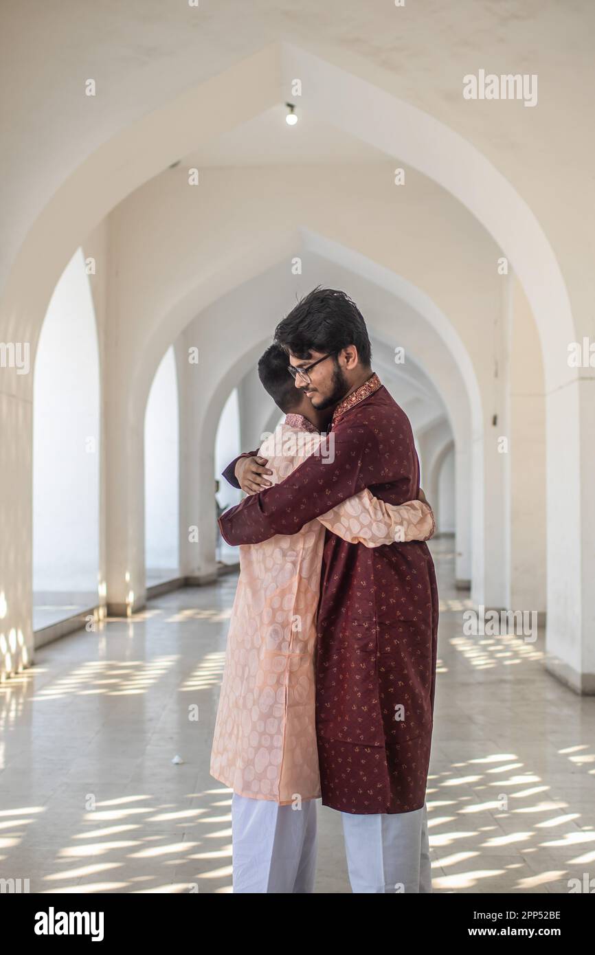Dhaka, Bangladesh. 22nd Apr, 2023. Muslims exchange greetings after performing Eid al-Fitr ...