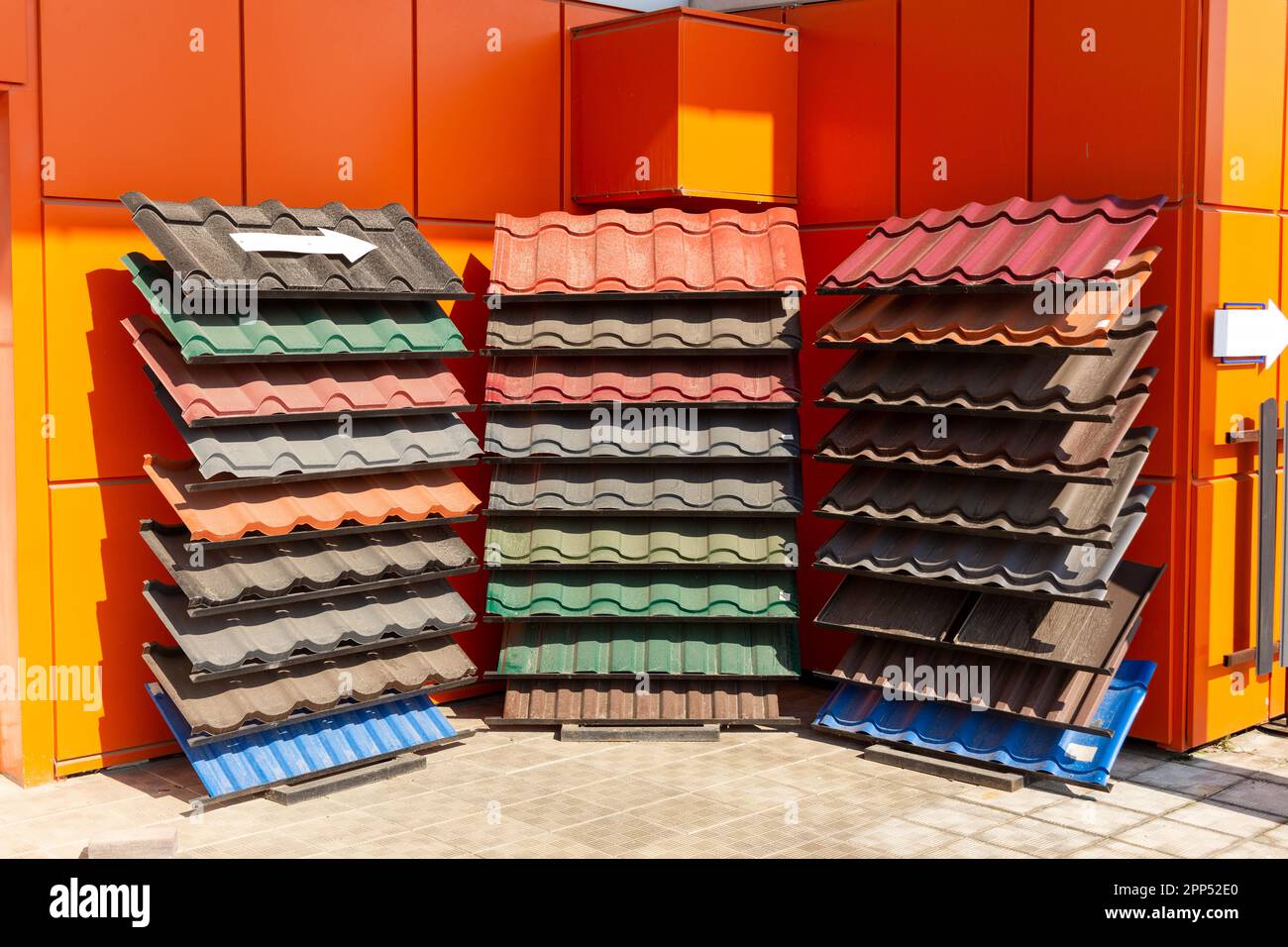 Samples of the colorful roof metal for home building. Multicolored ...