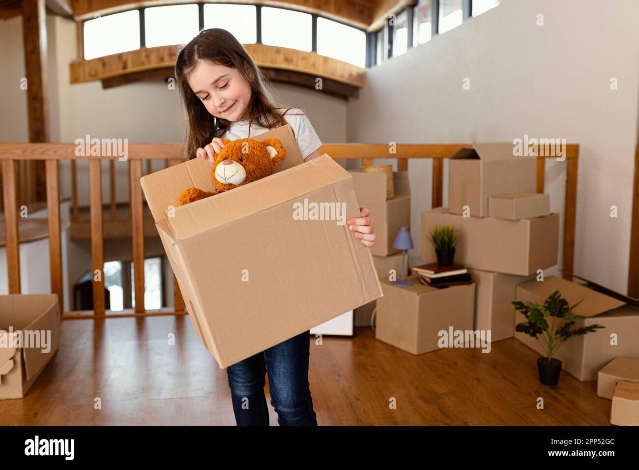 Girl holding box hi-res stock photography and images - Alamy