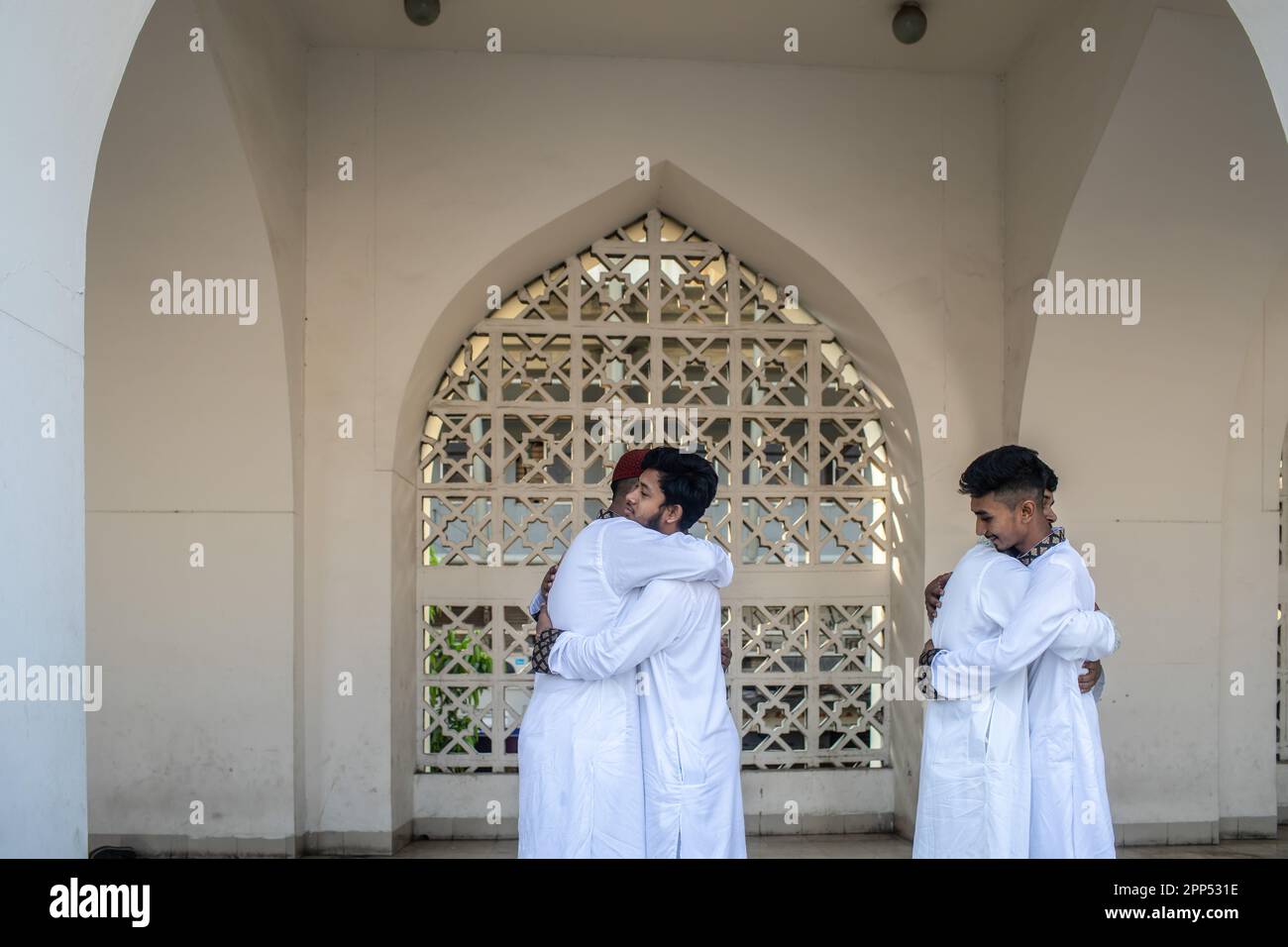 Muslims exchange greetings after performing Eid al-Fitr prayers marking the end of the holy ...