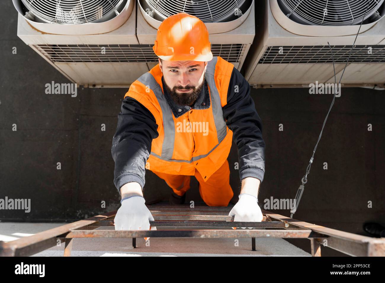 Man climbing ladder hi-res stock photography and images - Alamy