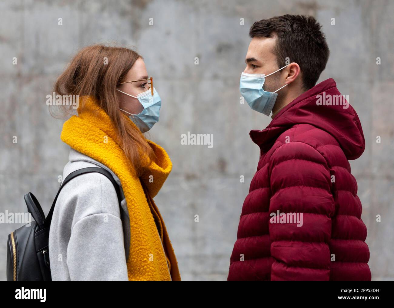 Side view couple wearing medical masks Stock Photo - Alamy