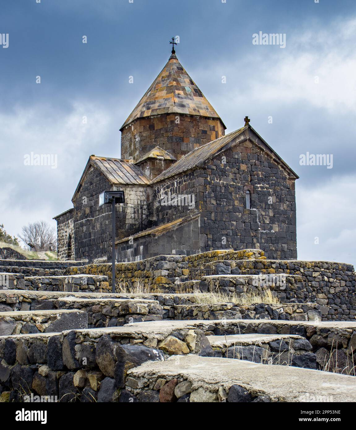 Old stone church in rural field scene concept photo. Monastery complex ...