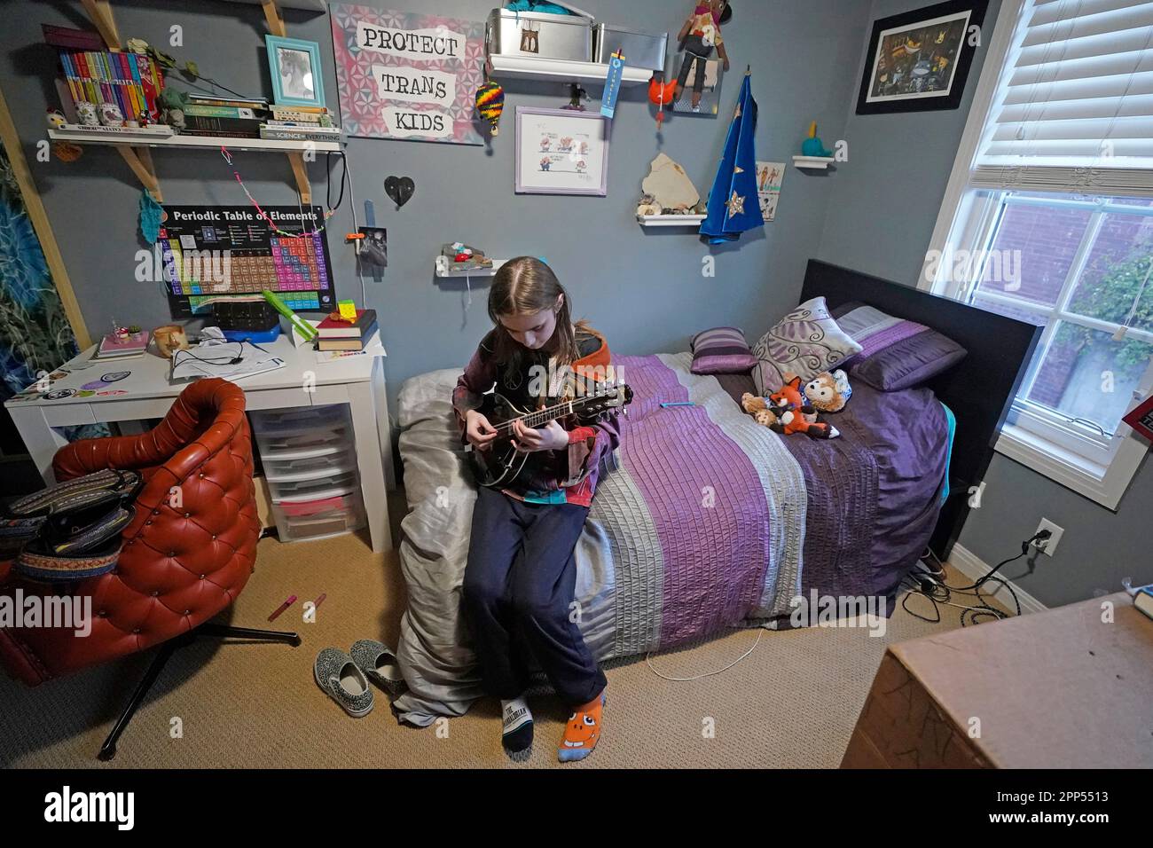 Elle Palmer, 13, plays her mandolin, Monday, Feb. 7, 2023, in Salt Lake City. Elle remembers her ...