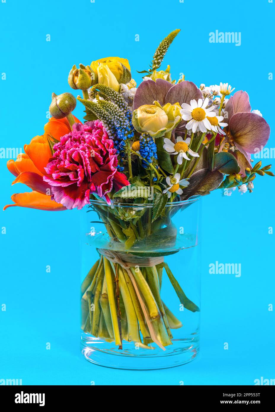 Closeup of a spring flower arrangement in a glass vase Stock Photo - Alamy