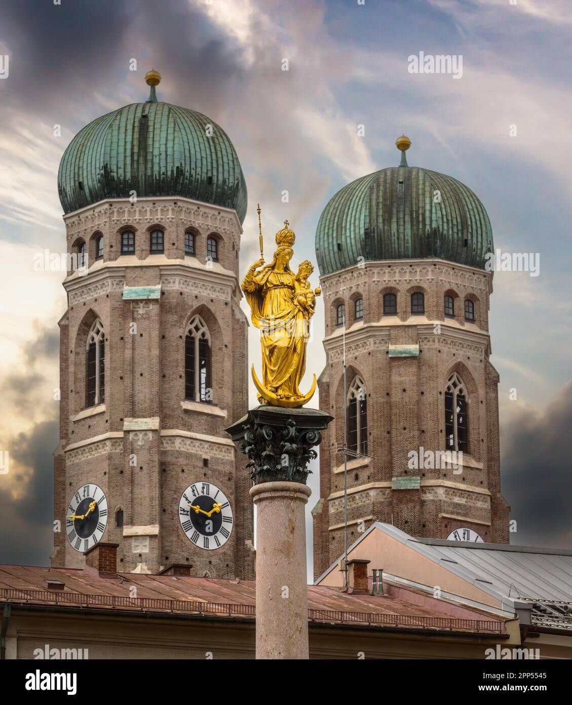 The towers of the Frauenkirche in Munich and the golden sculpture of ...