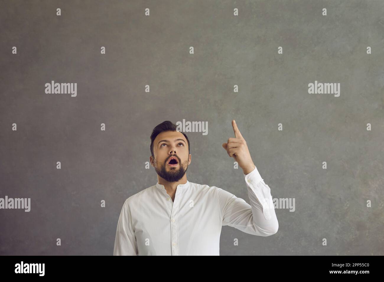Man with a surprised expression on his face is stunned by a thought or ...