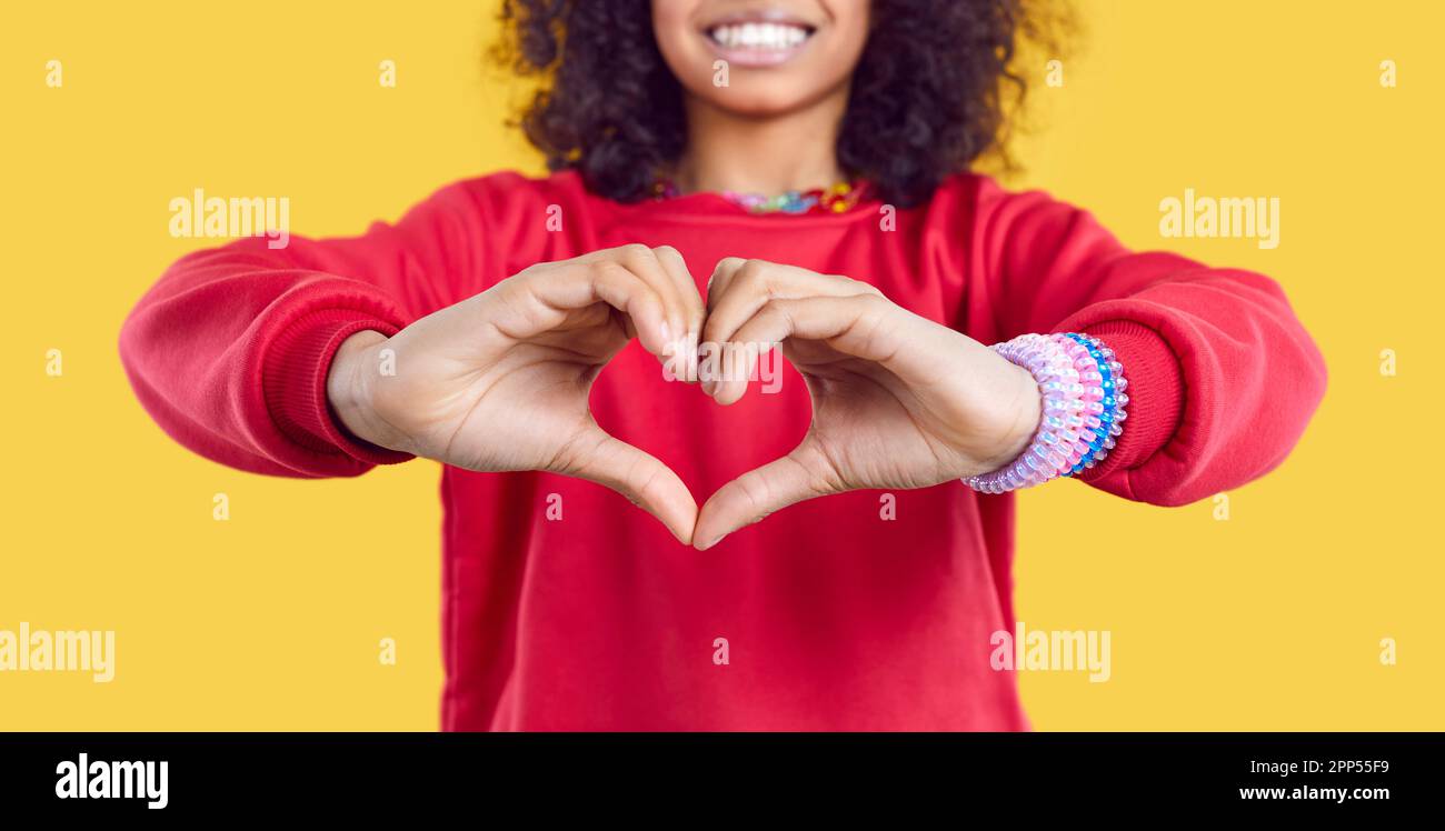 Banner of smiling girl show love hand gesture Stock Photo - Alamy