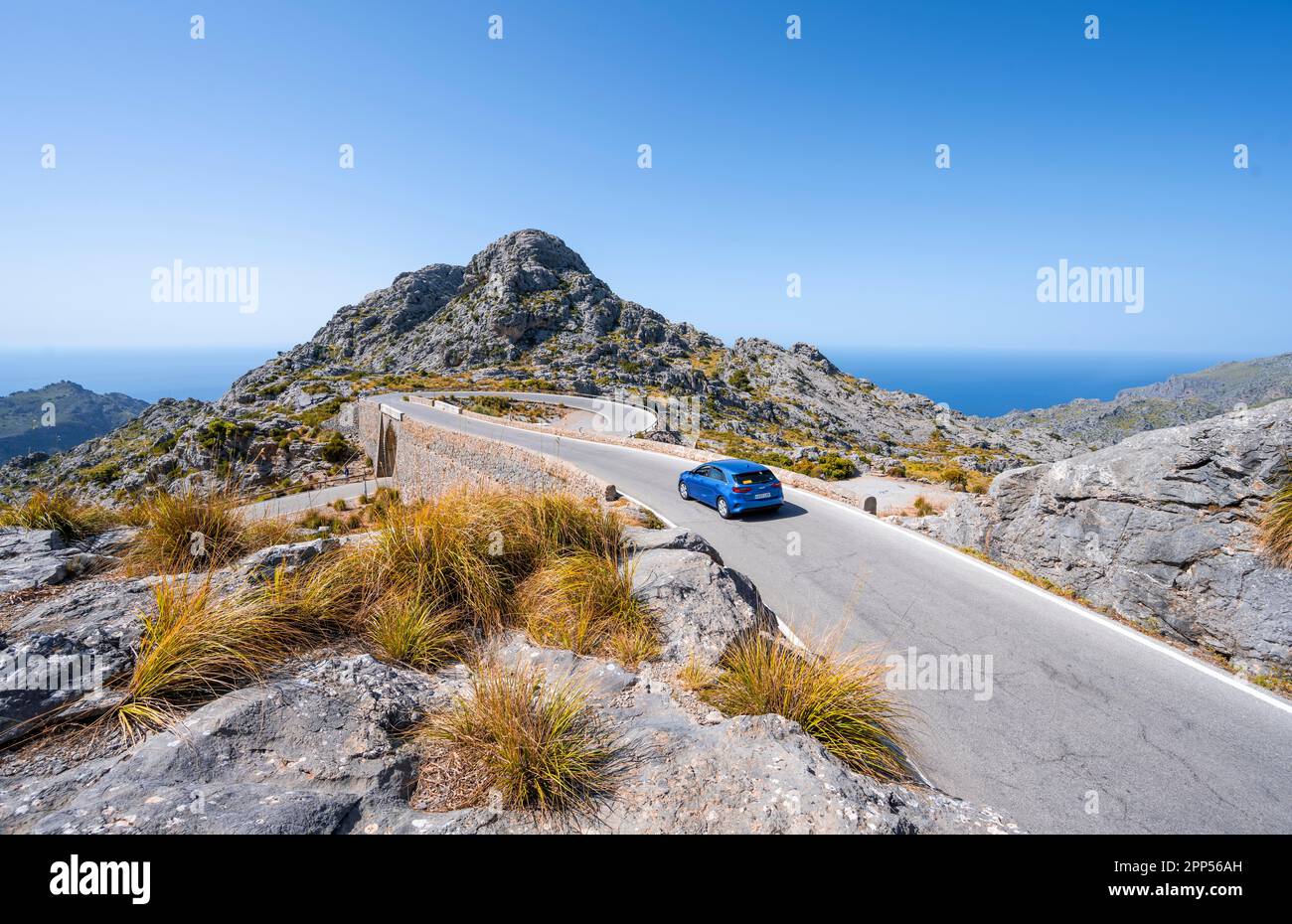 Car at the mountain pass with switchbacks to Sa Colobra, Nus de Sa ...