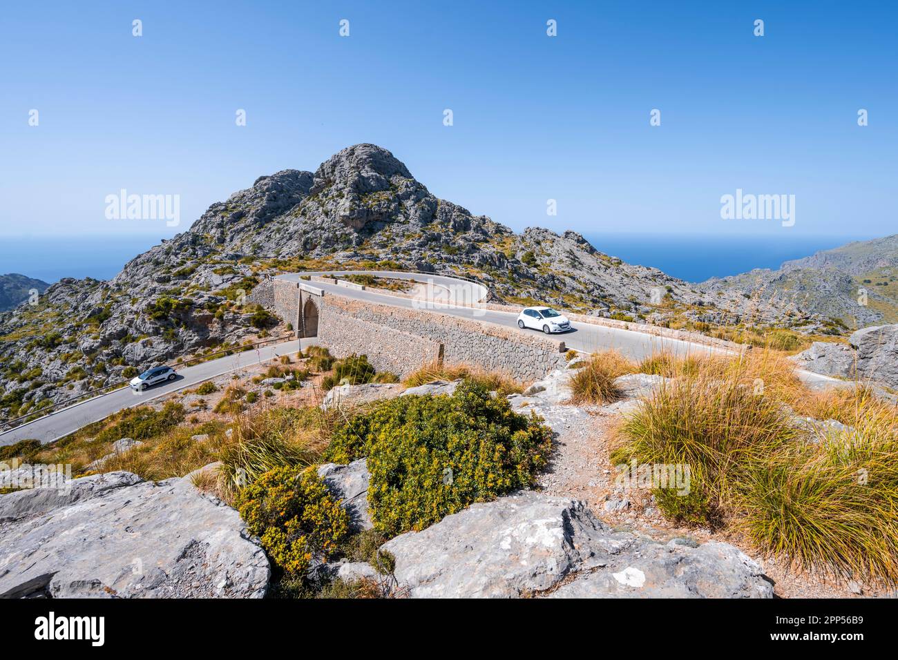 Car at the mountain pass with switchbacks to Sa Colobra, Nus de Sa ...