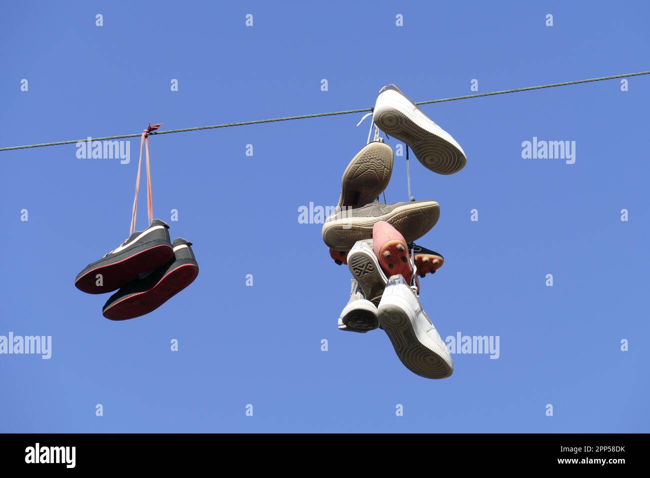Shoes on a leash, street art, Bremen, Germany Stock Photo - Alamy
