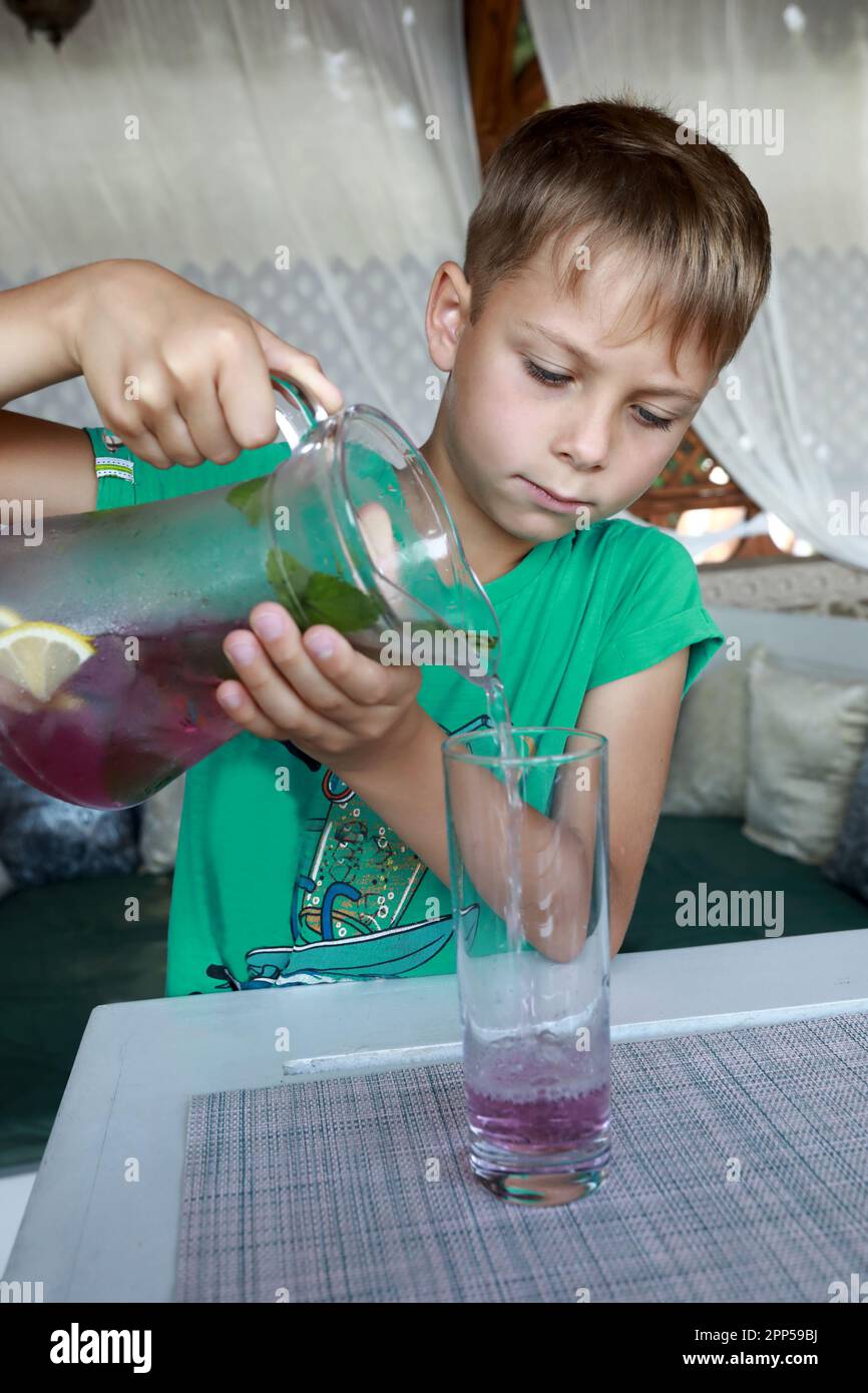 Child pouring lemonade hi-res stock photography and images - Alamy