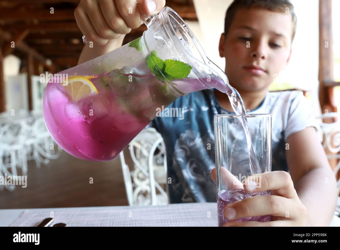 Child pouring lemonade hi-res stock photography and images - Alamy