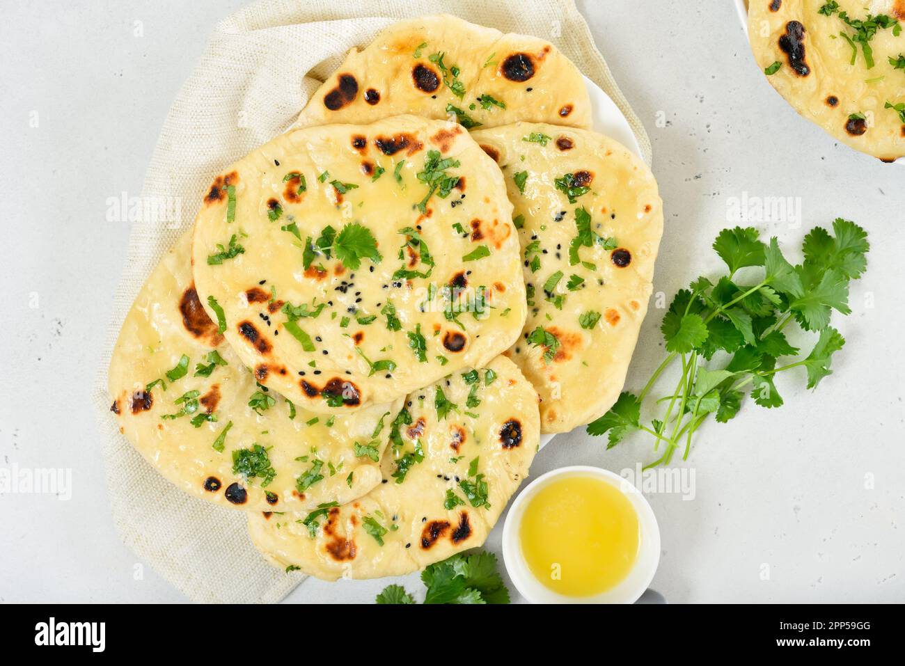 Homemade indian naan bread over light stone background. Top view, flat ...