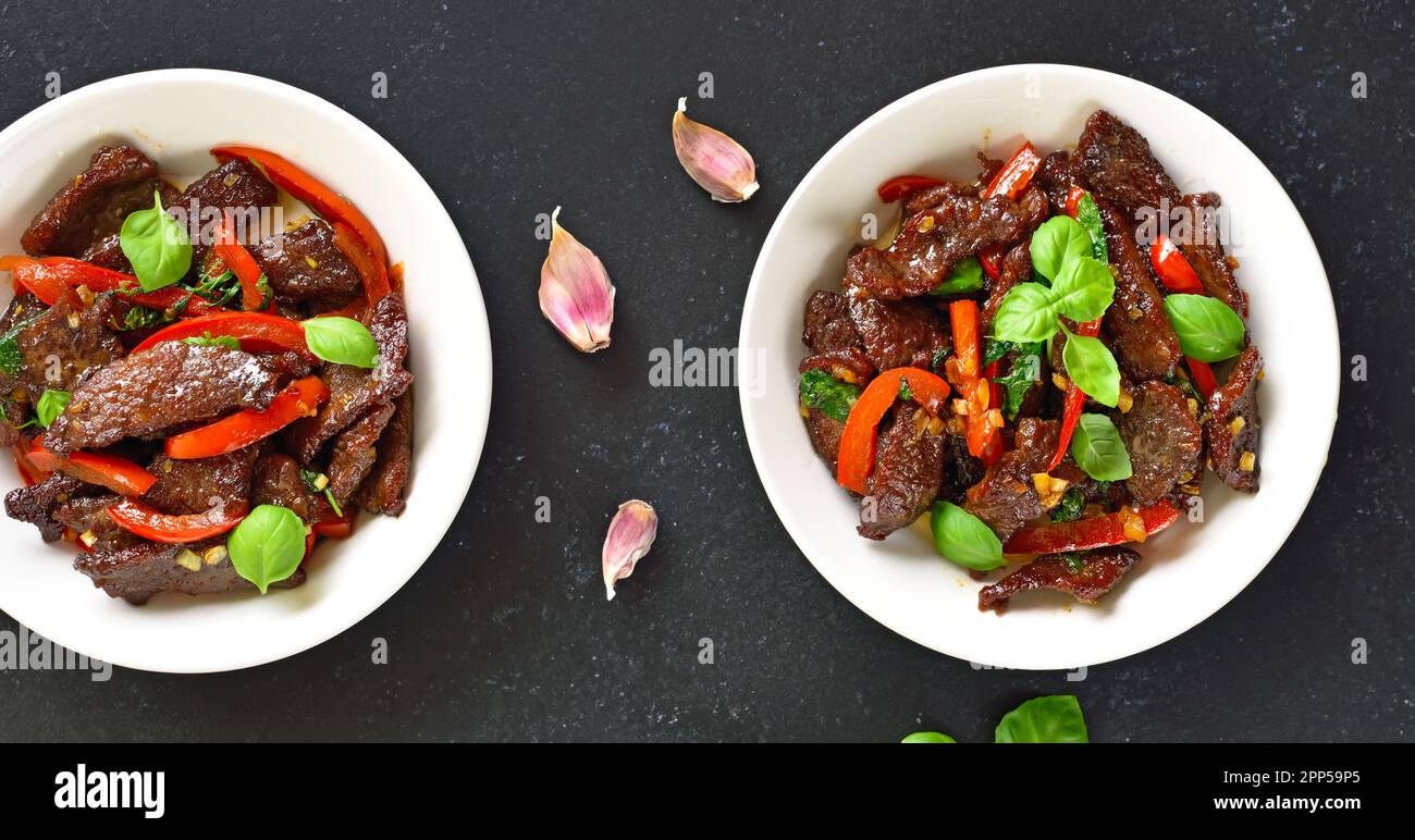 Thai style stir-fry beef with vegetables in bowl. Top view, flat lay ...