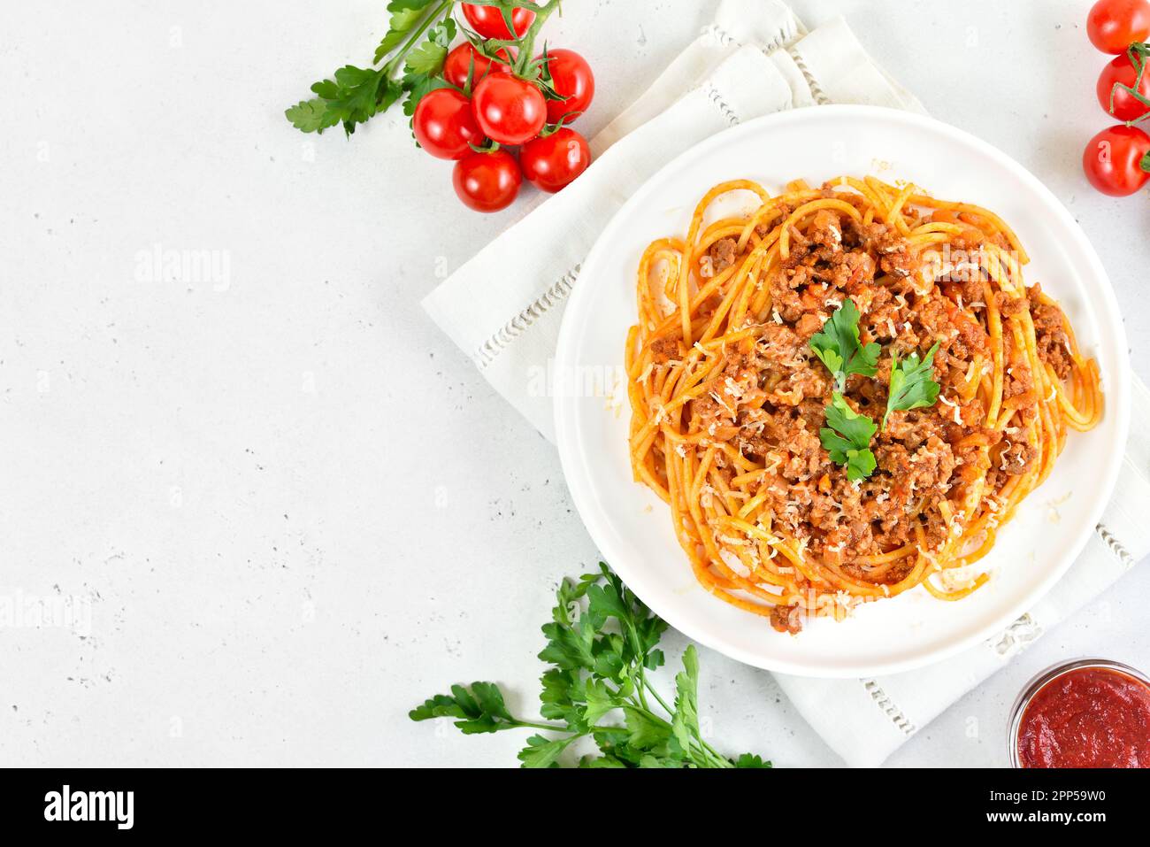 Italian spaghetti bolognese on plate over white stone background with ...