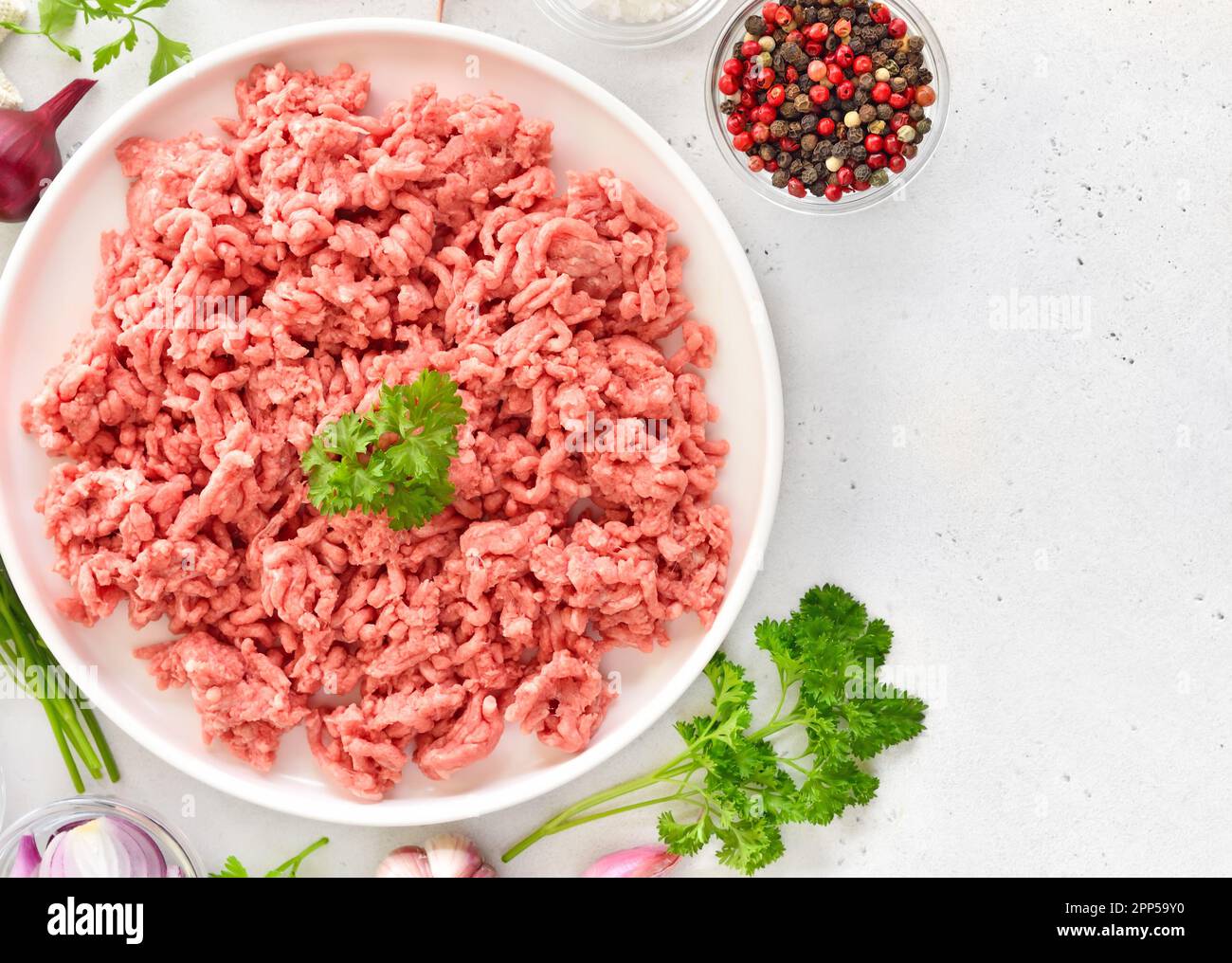 Raw beef minced meat over light background. Top view, flat lay Stock ...