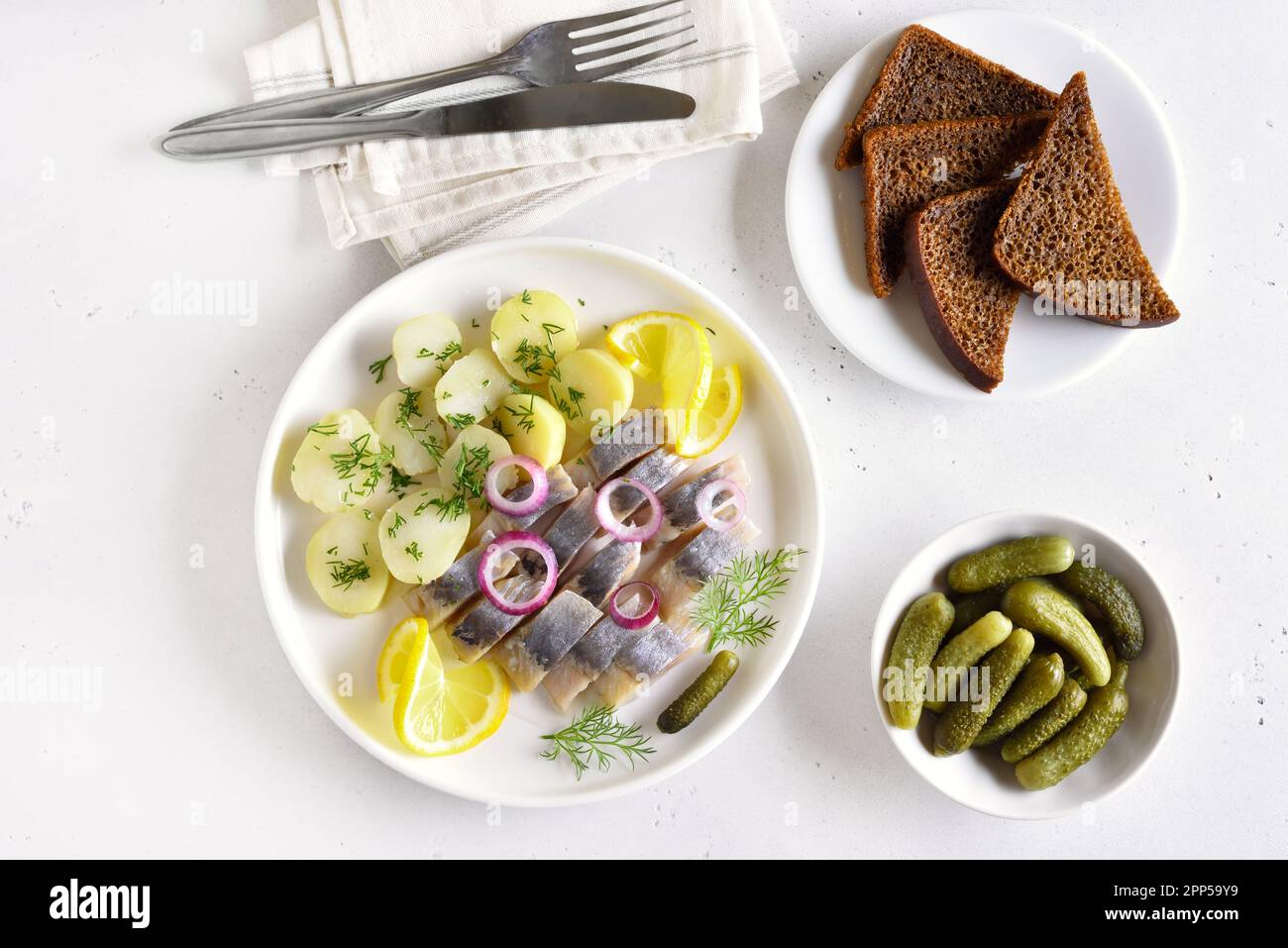 Sliced herring fish with boiled potatoes. Russian cuisine. Top view ...