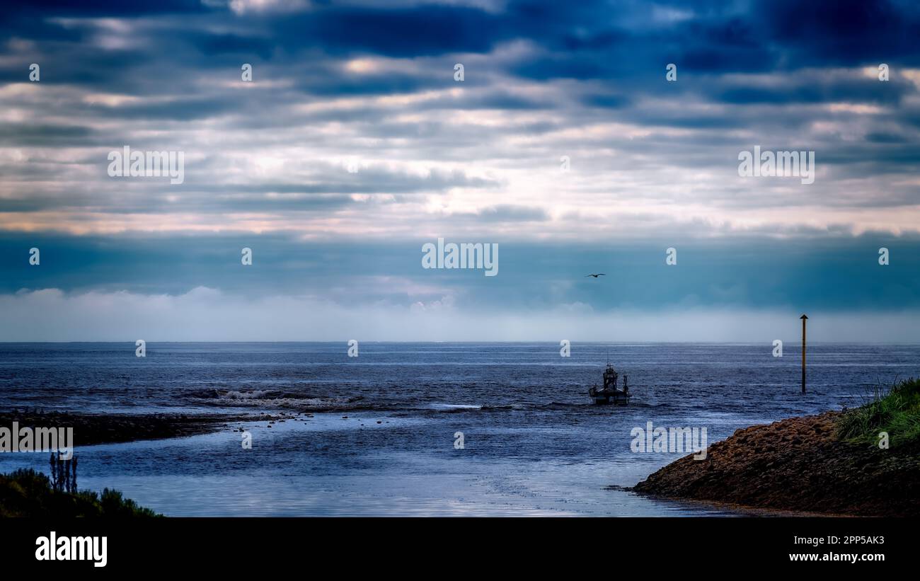 Boat sailing from Brora harbour Stock Photo - Alamy