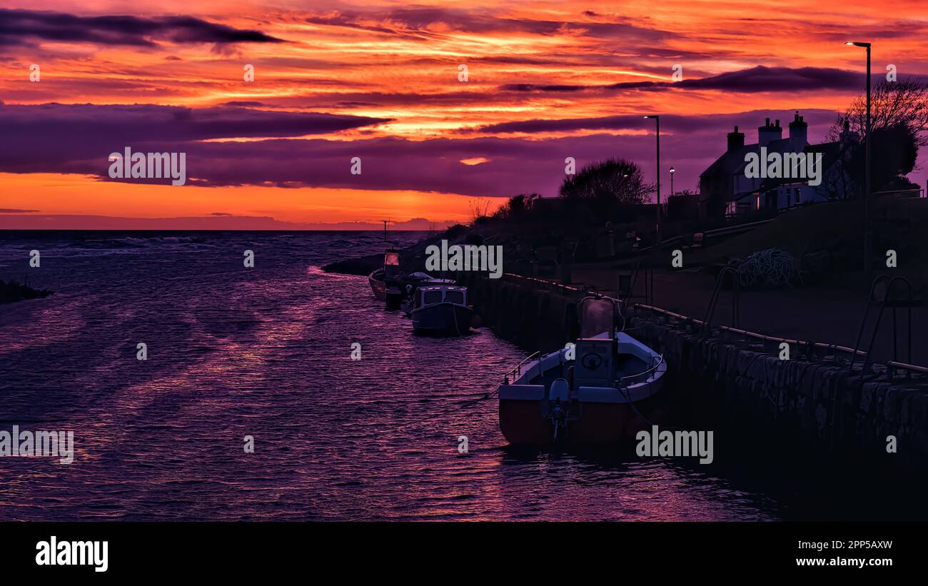 Brora harbour at sunrise with dawn colours in the sky Stock Photo - Alamy