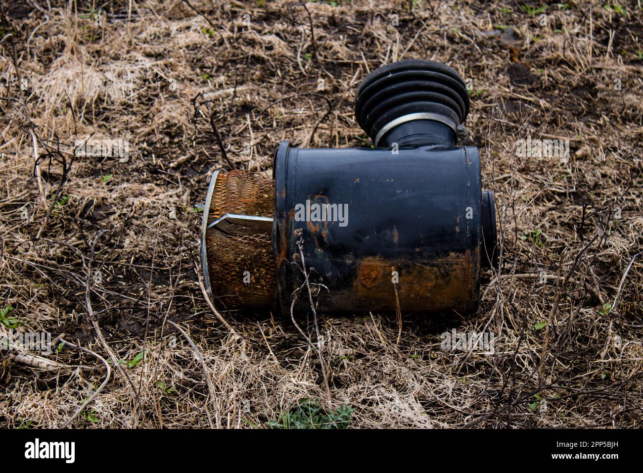 Aftermath of a mine explosion. The car is totally destroyed and debris ...