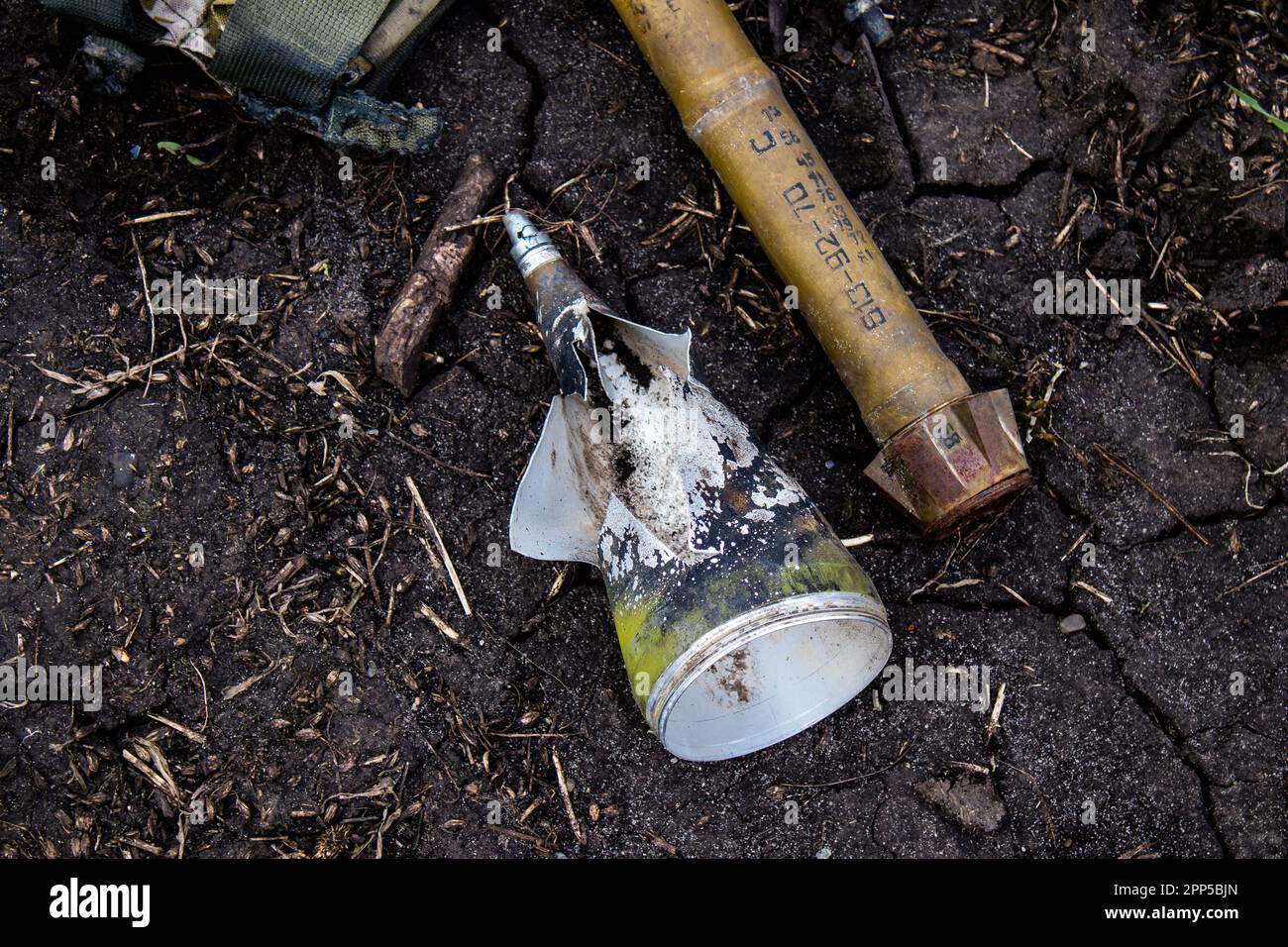 Aftermath of a mine explosion. The car is totally destroyed and debris ...