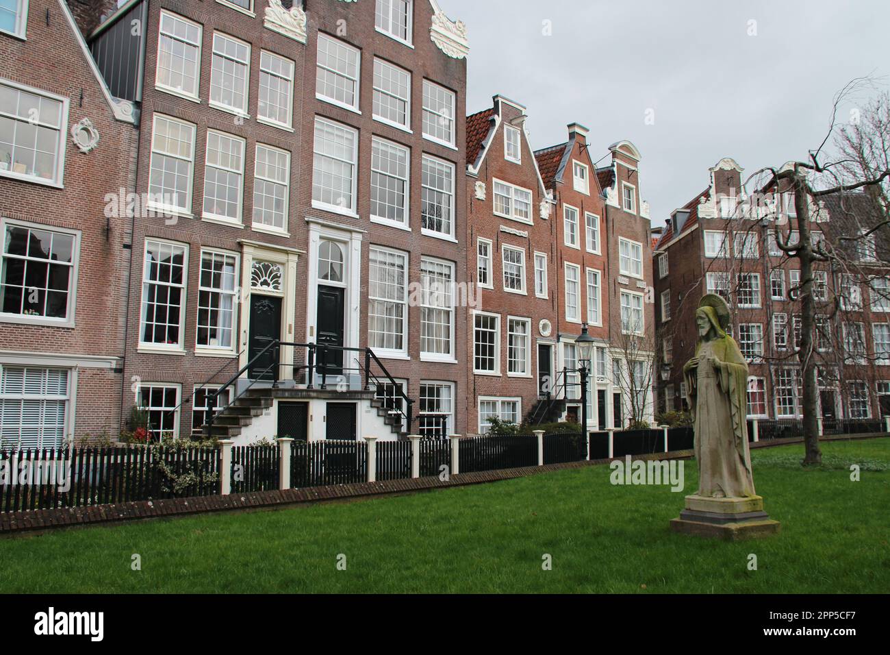old brick house at a beguinage (begijnhof) in amsterdam (the ...