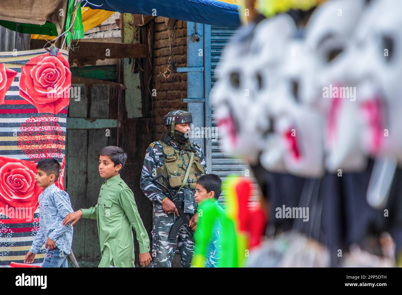 Srinagar, India. 22nd Apr, 2023. Kashmiri children walk past Indian ...