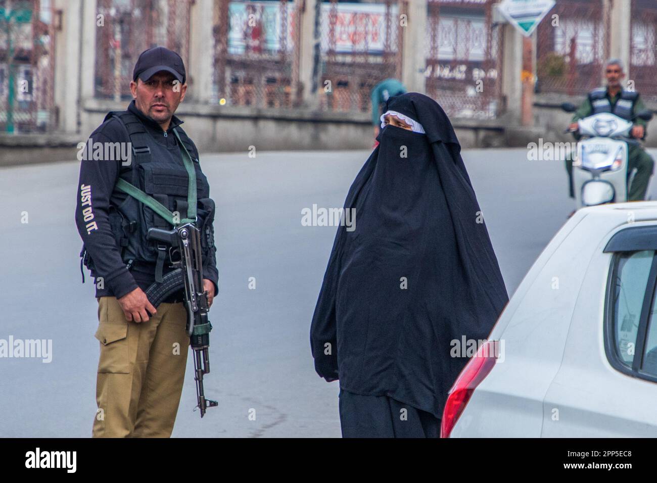 Srinagar, India. 22nd Apr, 2023. A Kashmiri Burqa-clad woman walks past ...