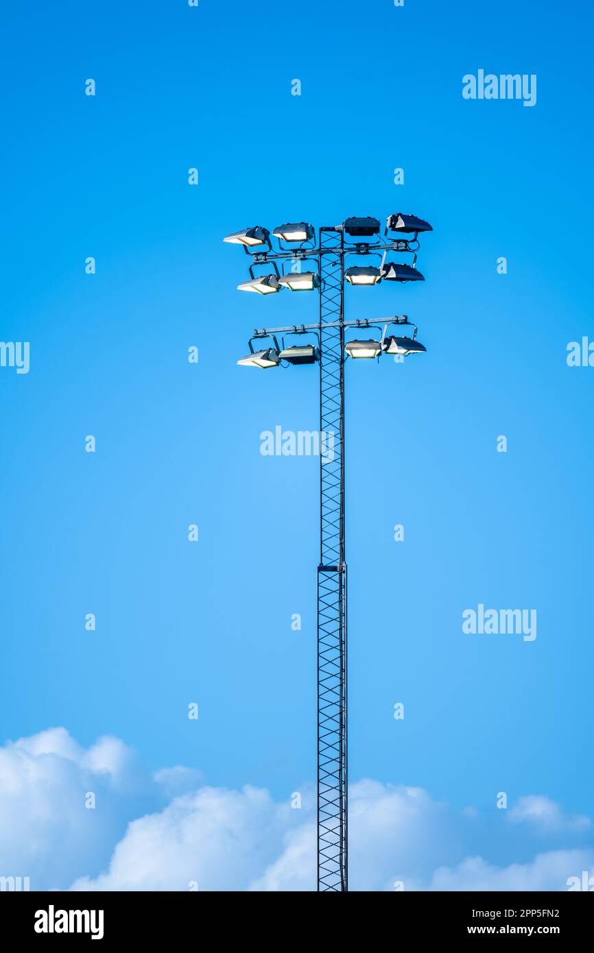 Tall pylon with flood lights on top Stock Photo - Alamy
