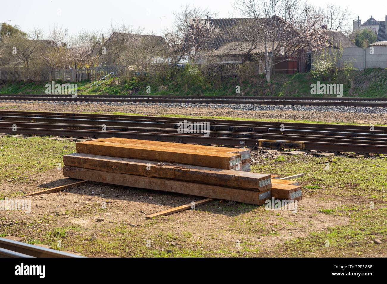 A stack of new wooden sleepers to replace the failed ones. Wooden ...