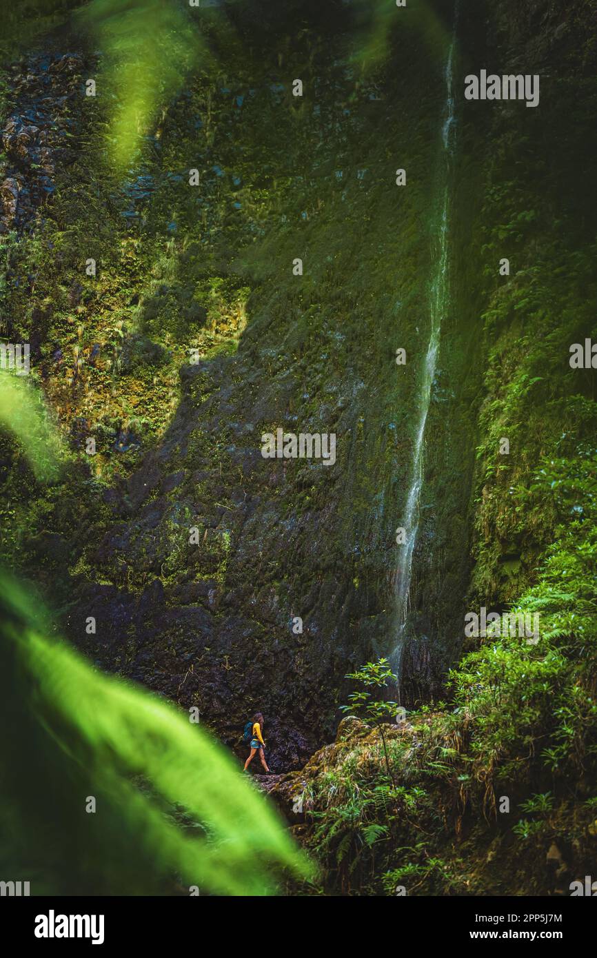 Description: Backpacker woman in the distance looking at scenic ...