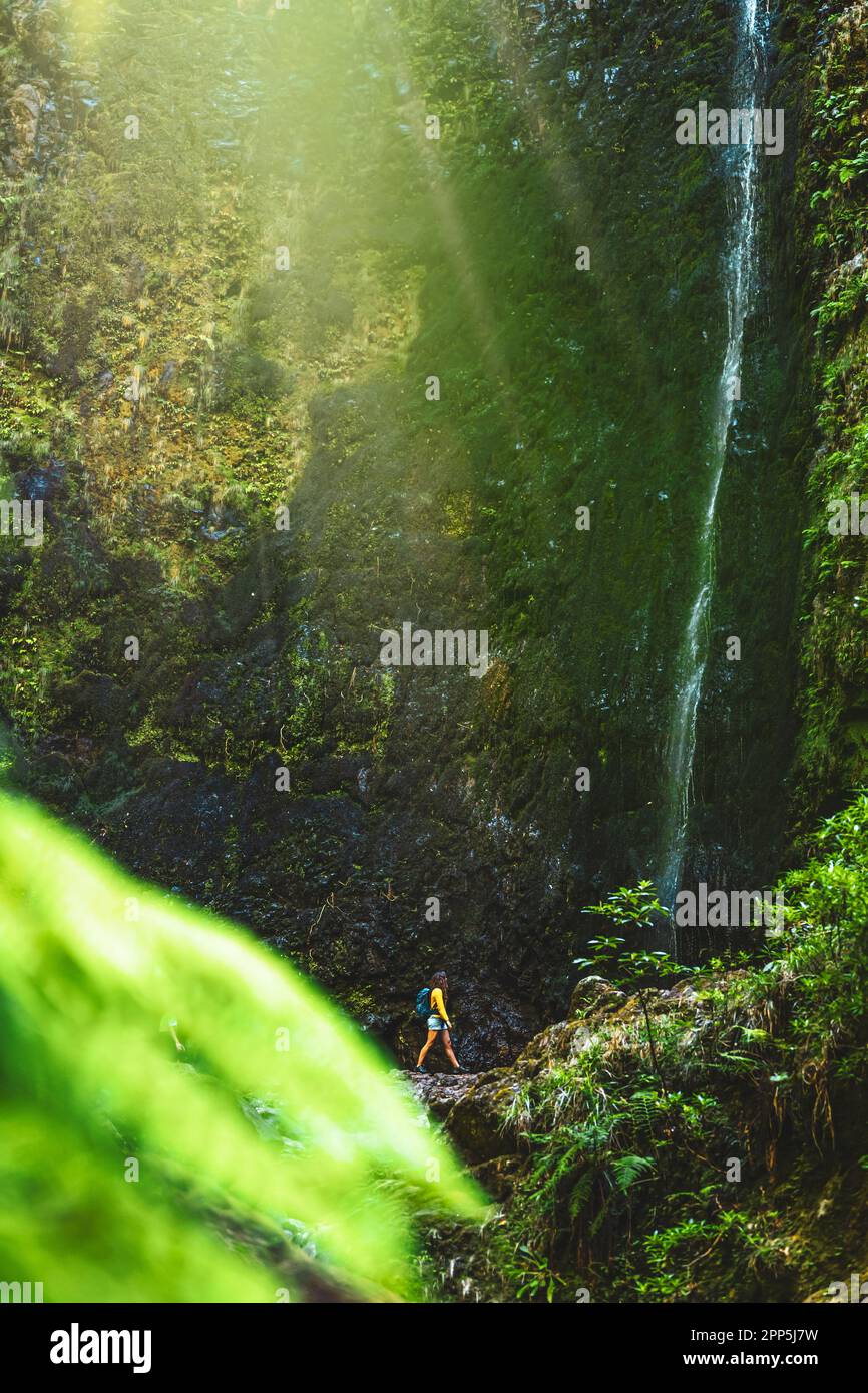 Description: Backpacker woman in the distance looking at scenic ...