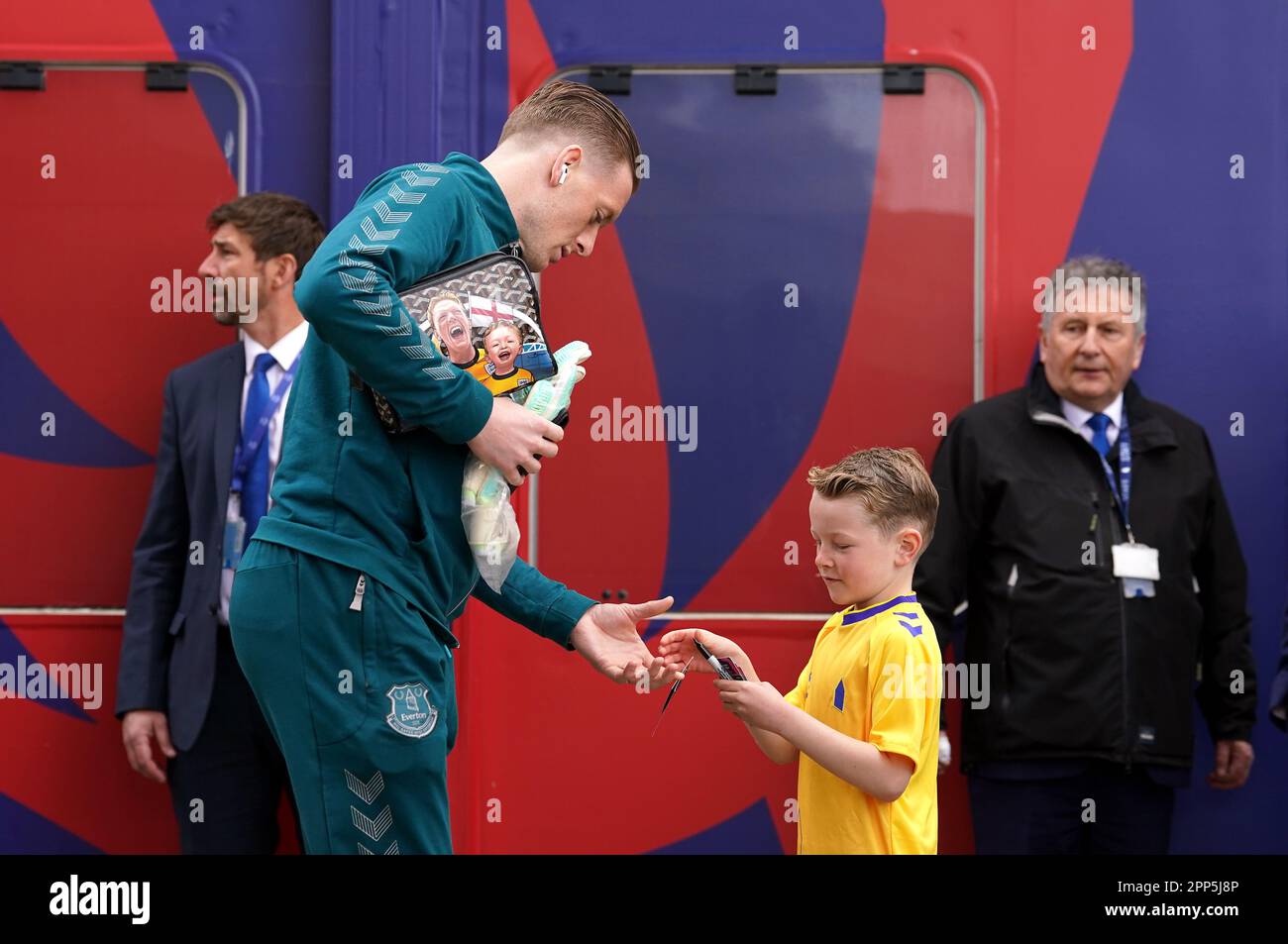 Everton goalkeeper Jordan Pickford signs an autograph for a fan as he ...