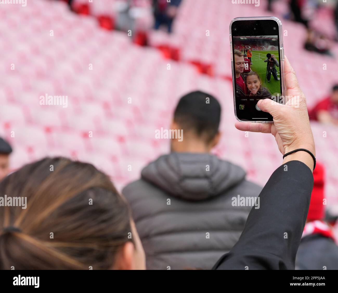 A fan takes a selfie before the Premier League match Liverpool vs ...